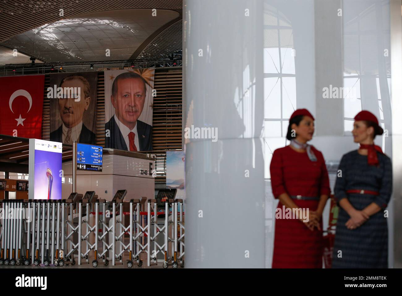 Backdropped by posters of modern Turkey's founder Mustafa Kemal Ataturk ...