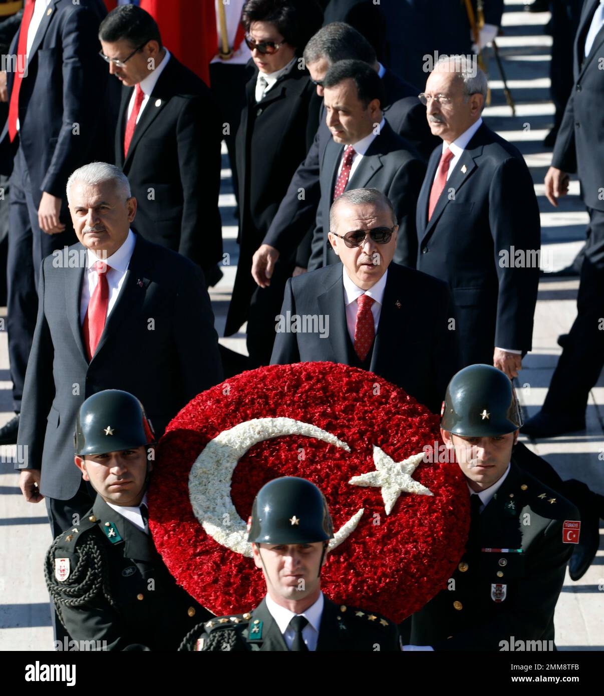 Turkey's President Recep Tayyip Erdogan, center, follows a military ...