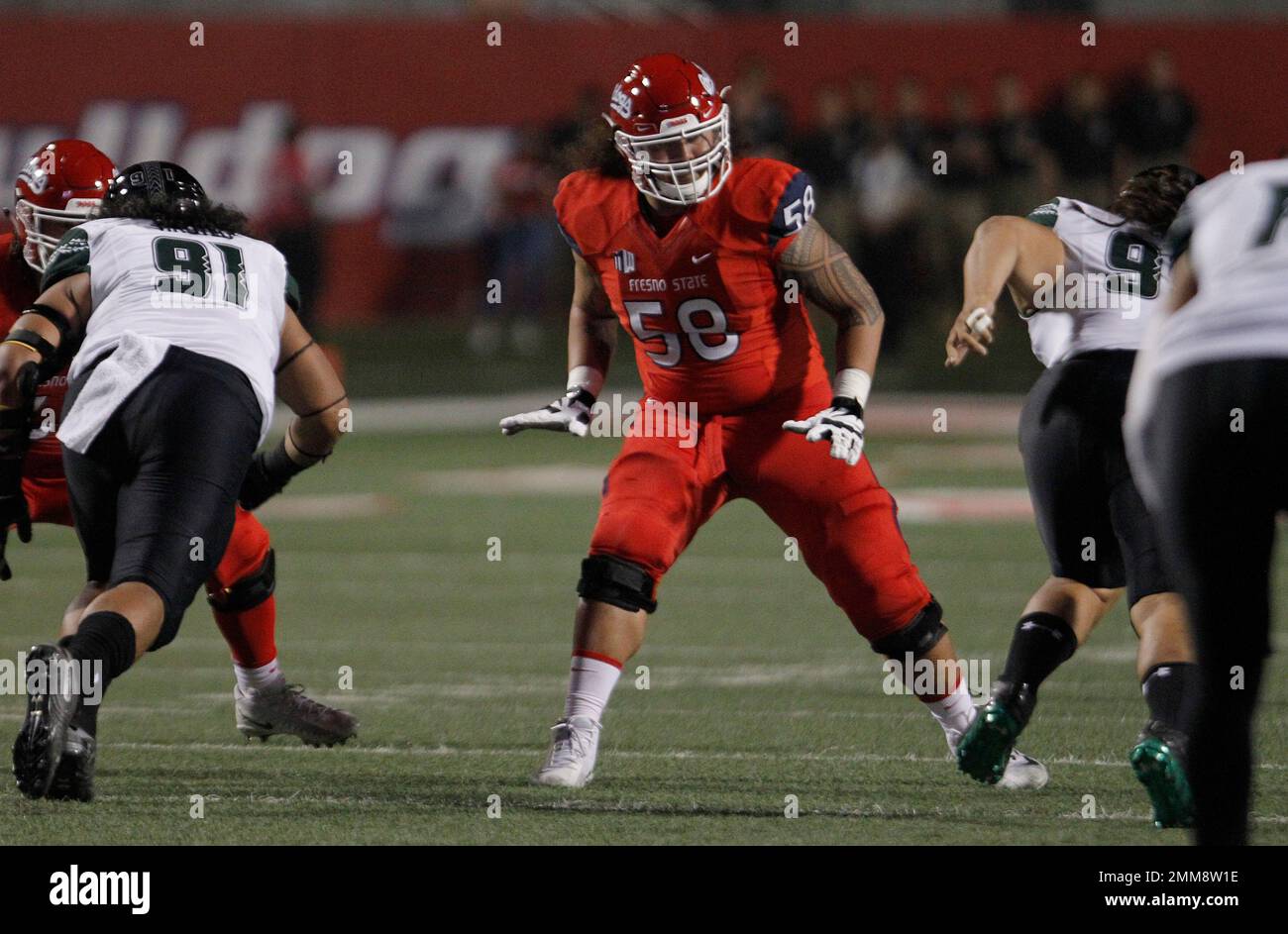 Fresno State offensive lineman Christian Cronk guards against Hawaii ...