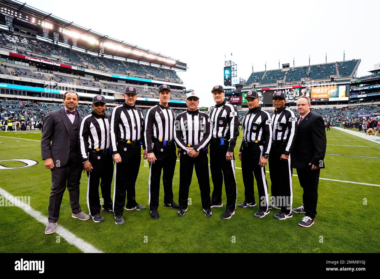 From left, back judge Terrence Miles (111), side judge Allen Baynes (56 ...