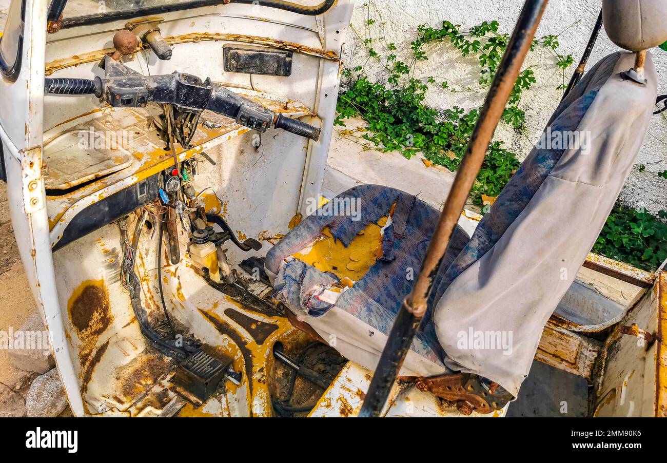 Old white broken wrecked tuk tuk rikshaw wreck in Zicatela Puerto ...
