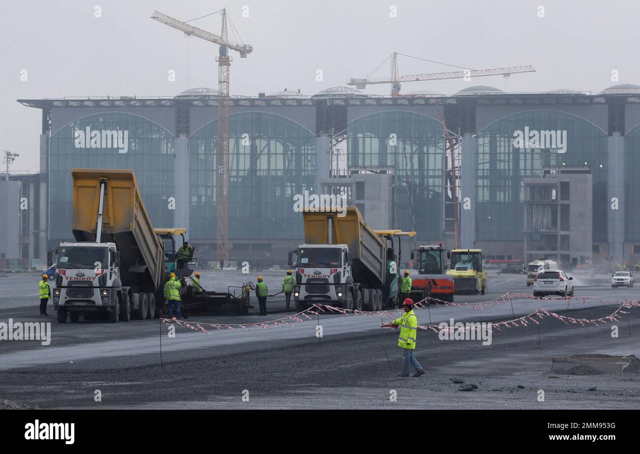 FILE-In this April 13, 2018, file photo, construction workers at ...