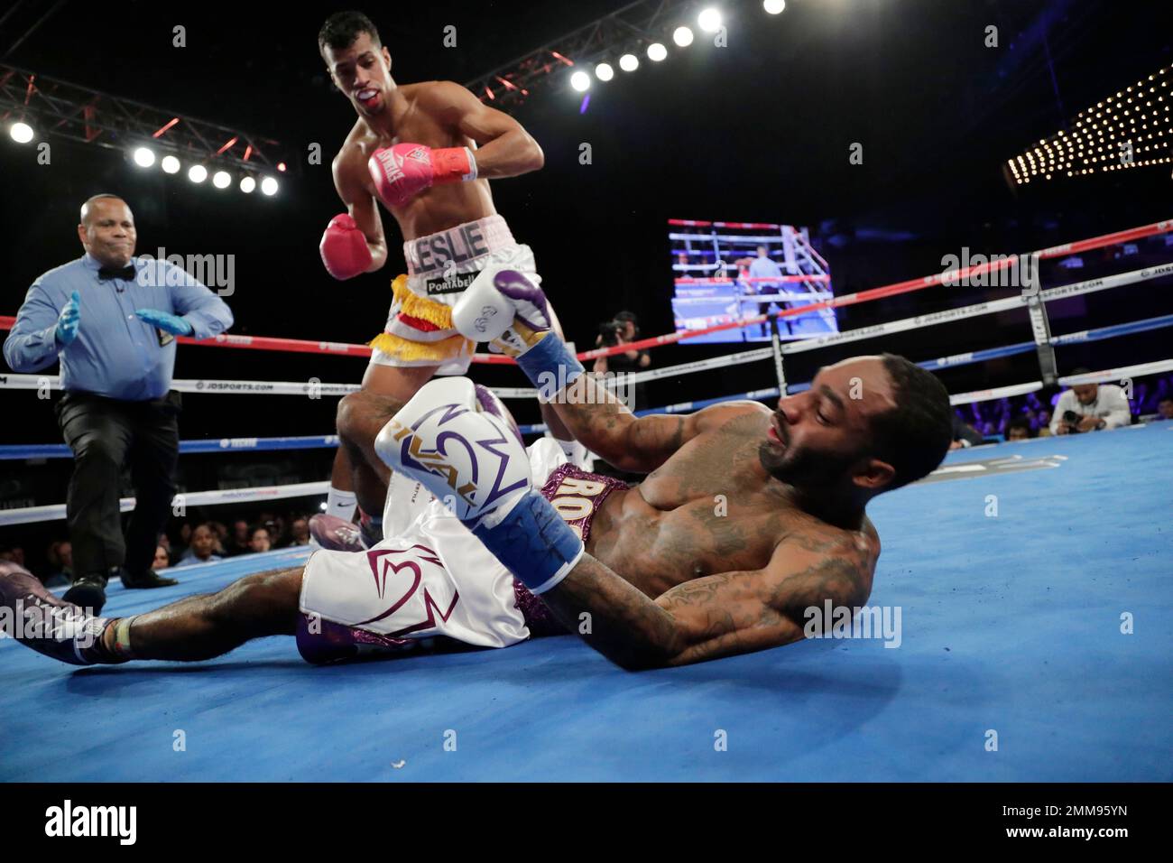 Puerto Rico's Alberto Machado, left, knocks down Yuandale Evans during ...