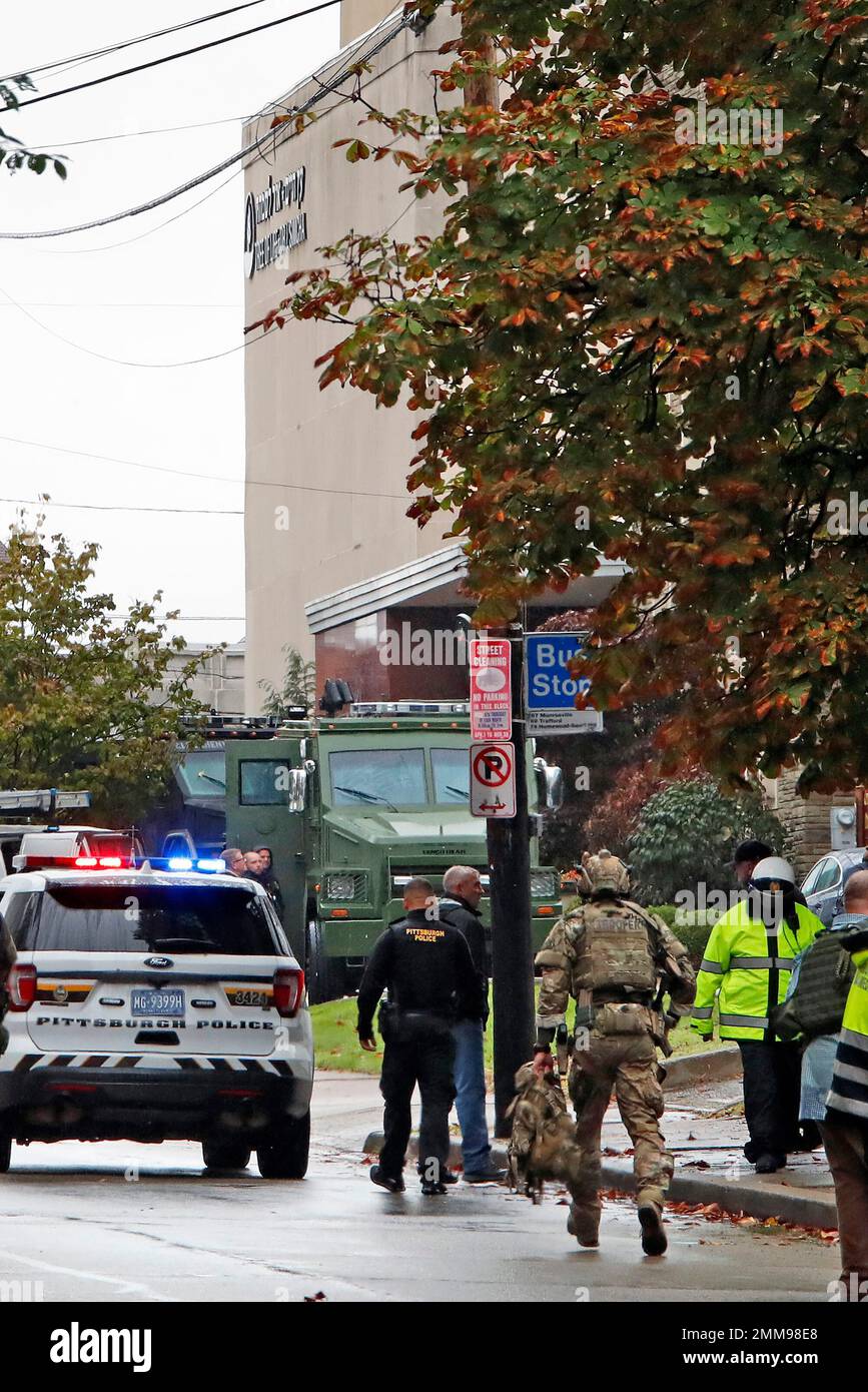 First responders surround the Tree of Life Synagogue, rear center ...