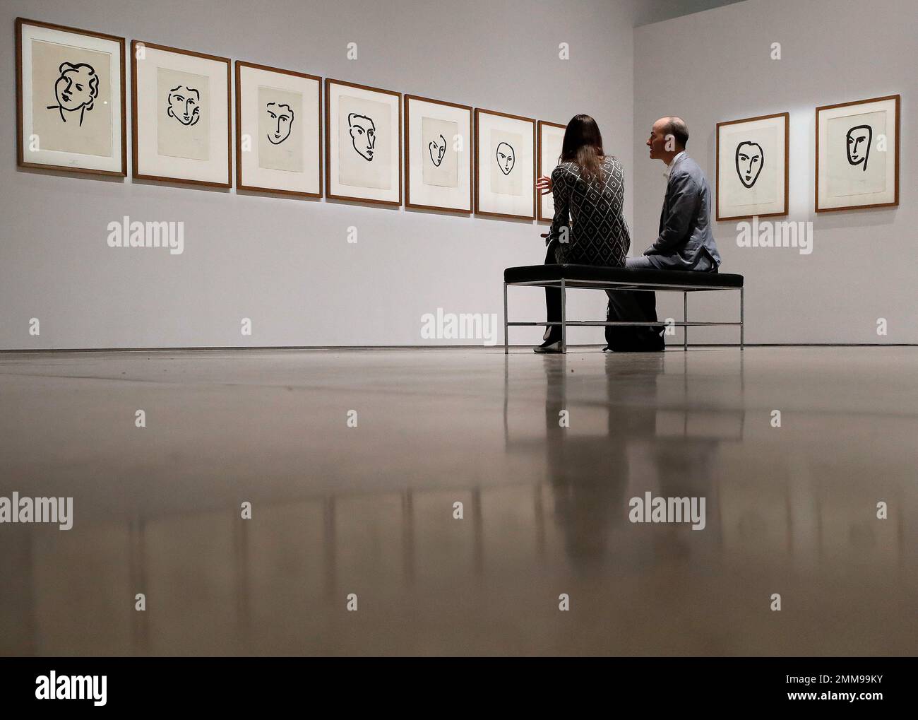 Curator Sean Mooney views the final installation of a selection of ...