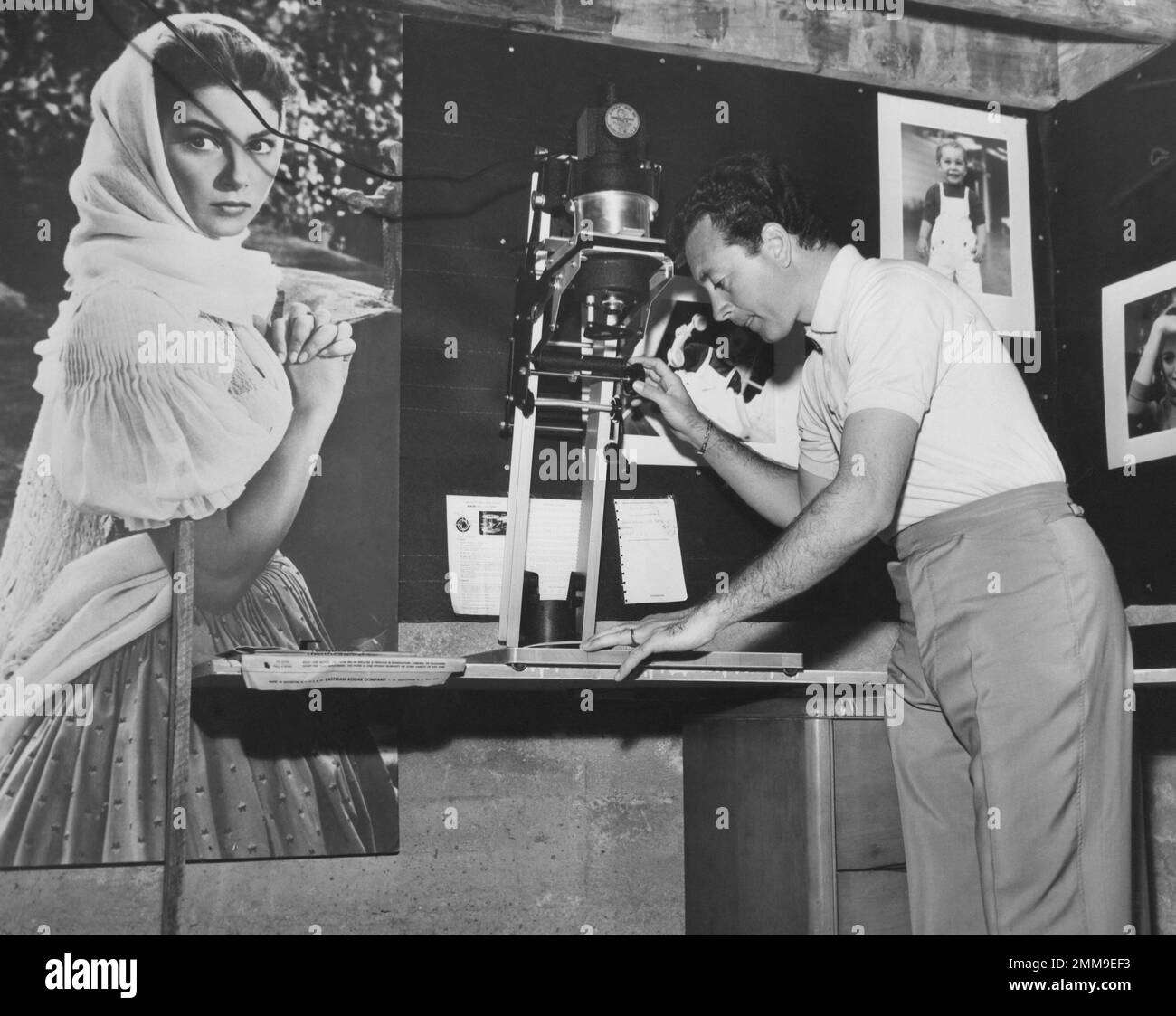 An ardent camera fan, Vic Damone works in the photo darkroom in the ...