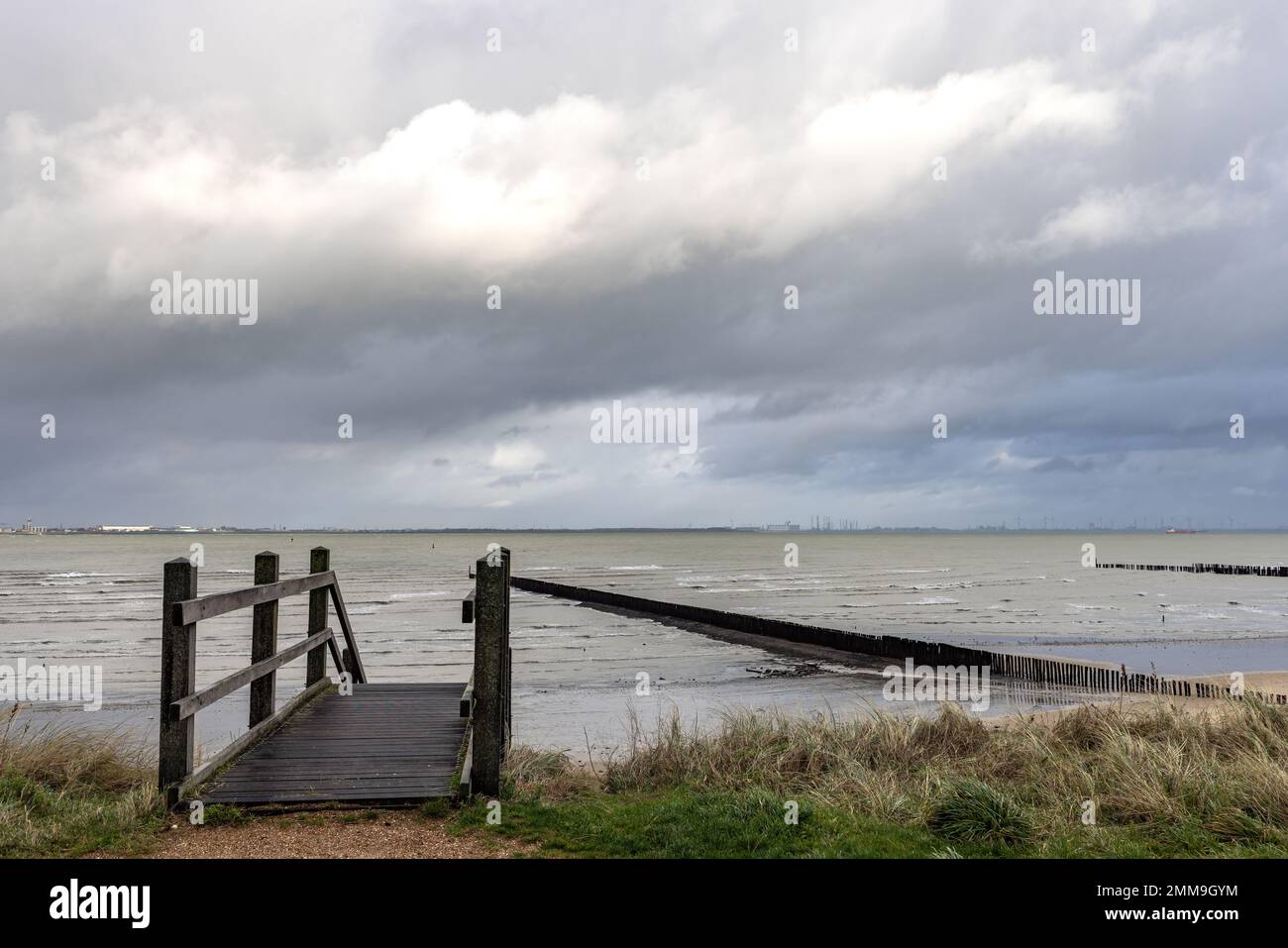 Beautiful sea view with wave breakers on the beach of Breskens, Zeeland ...