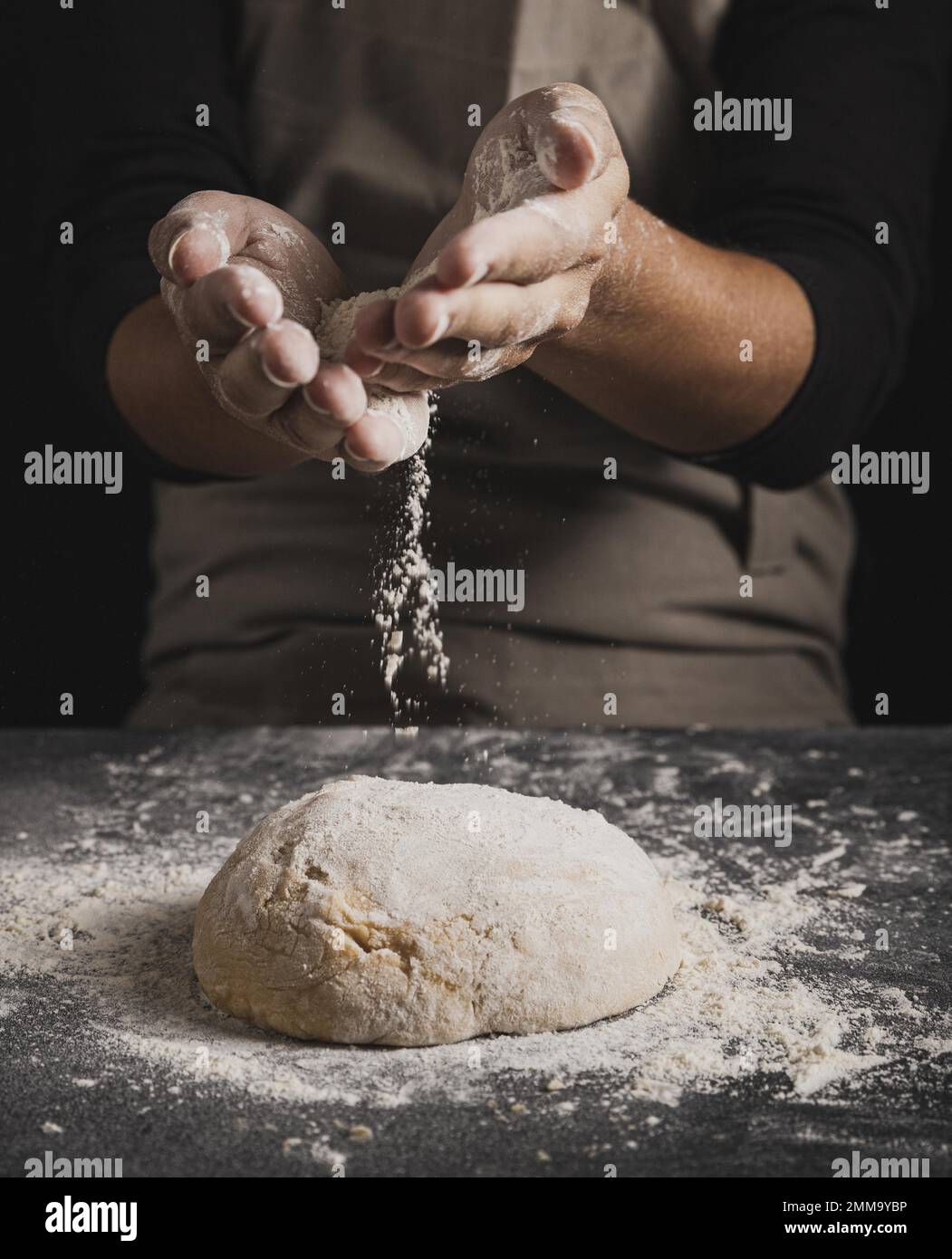 close up baker hands spreading flour. Resolution and high quality ...
