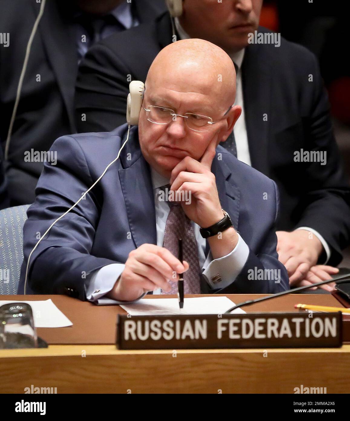 Russia's U.N. Ambassador Vassily Nebenzia listens, during a meeting of ...