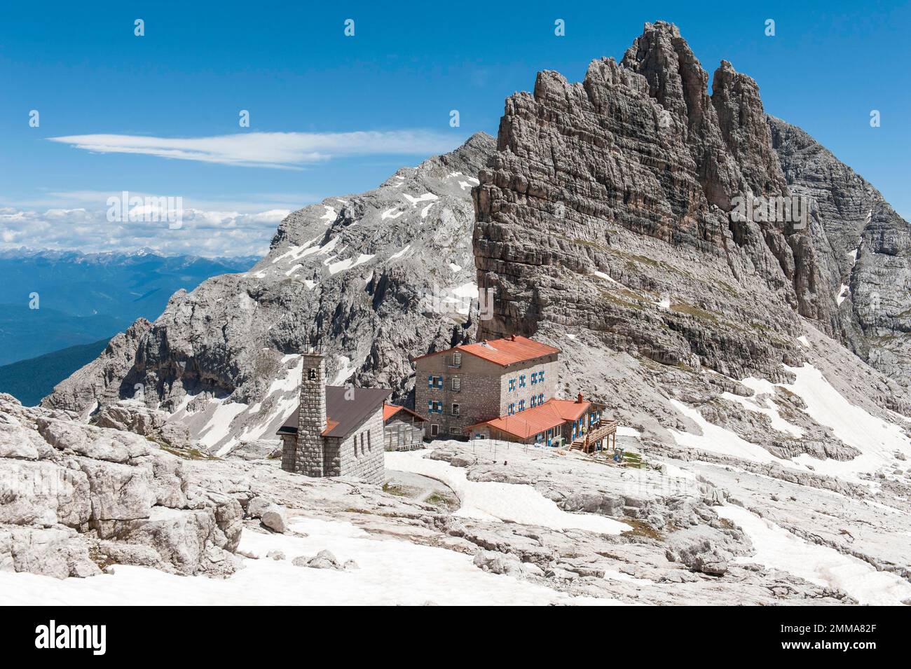 Alpine refuge Rifugio Pedrotti and chapel with rock Croz del Rifugio ...