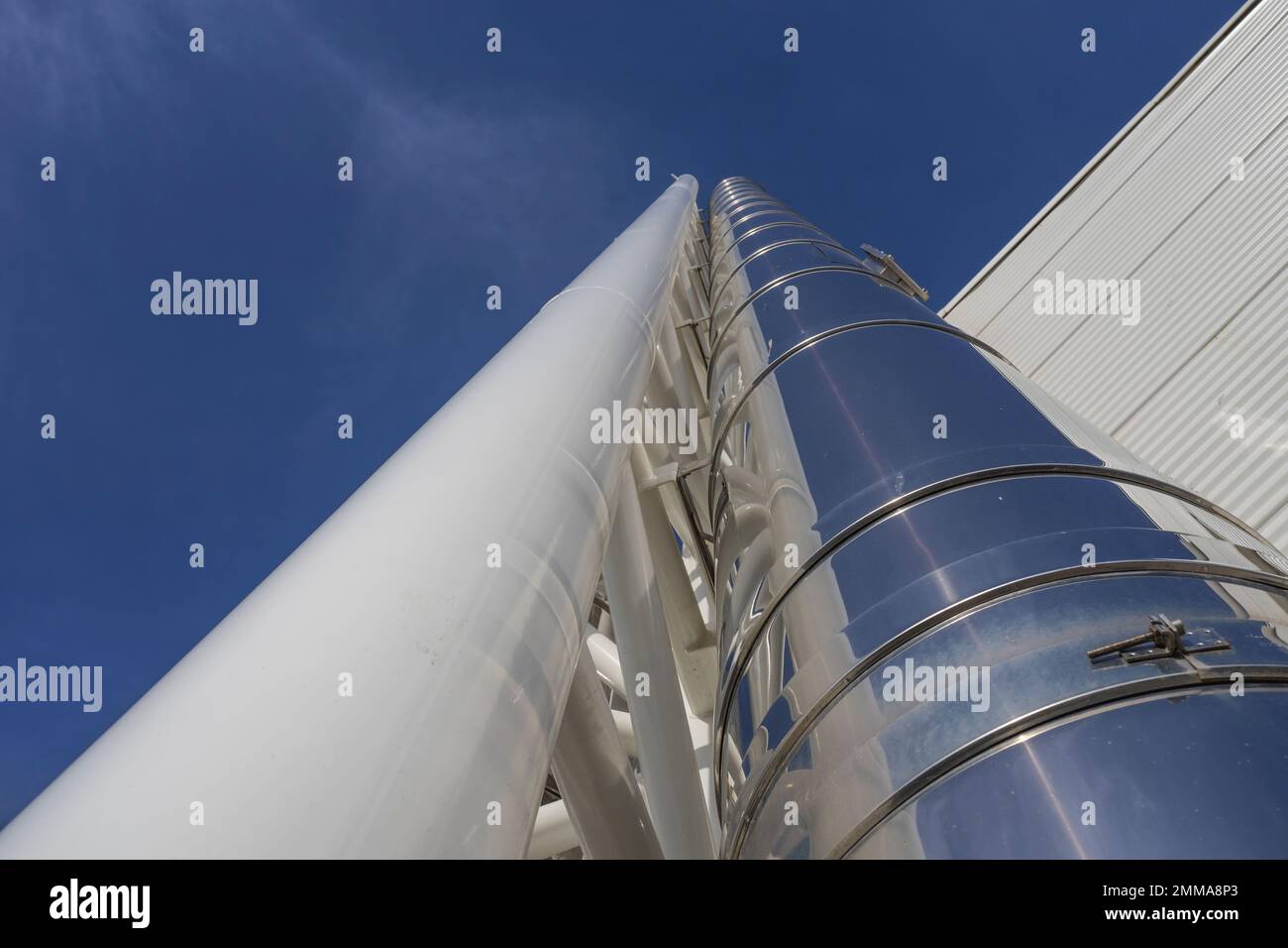 stainless steel chimney on a industrial building Stock Photo - Alamy