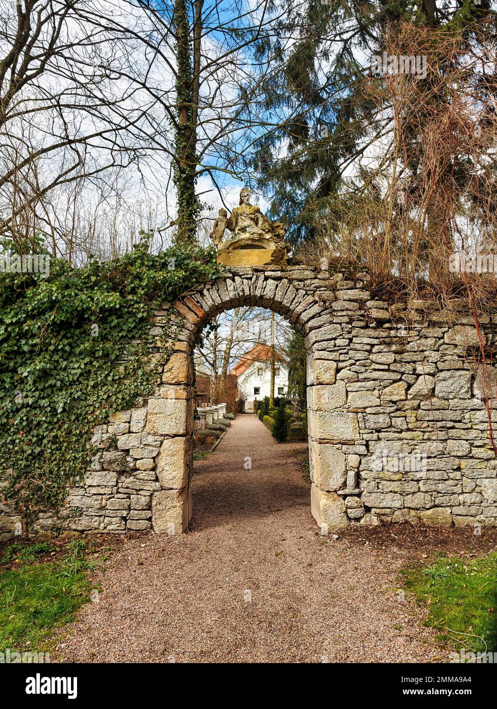 Sculpture on wall with gate to baroque garden, Rheder Castle, Brakel ...