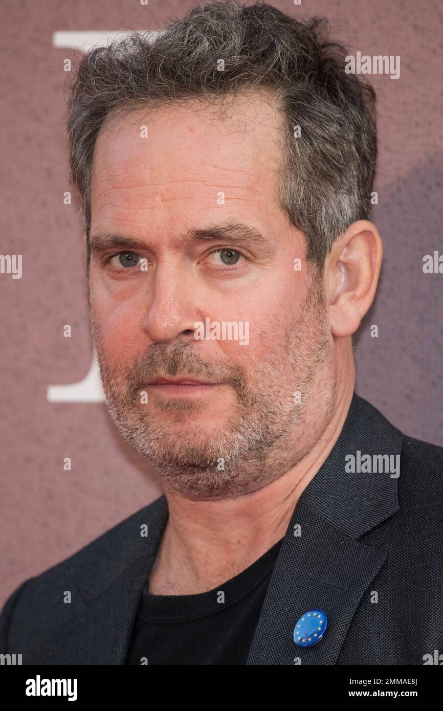 Actor Tom Hollander poses for photographers upon arrival at the ...