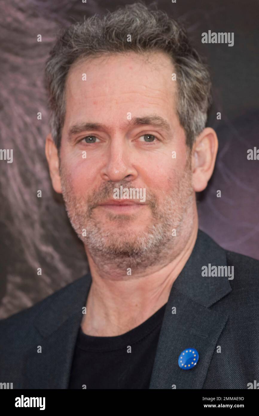Actor Tom Hollander poses for photographers upon arrival at the ...