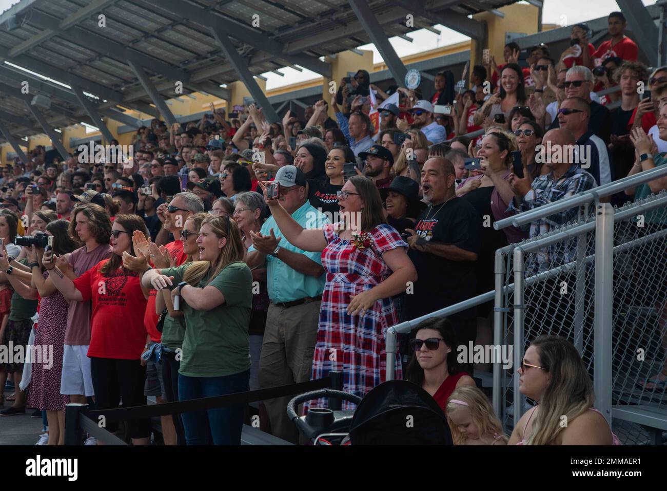 Families with Charlie Company, 1st Recruit Training Battalion, cheer ...