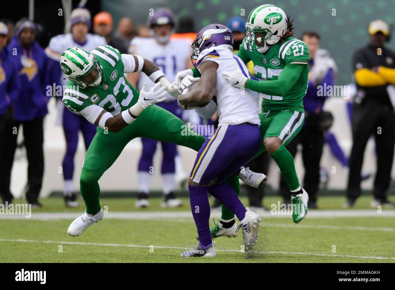 New York Jets' Darryl Roberts (27) and Jamal Adams (33) tackle ...