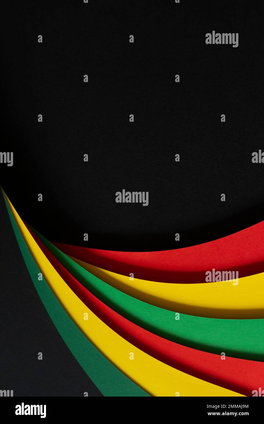 Abstract geometric black, red, yellow, green color paper background ...
