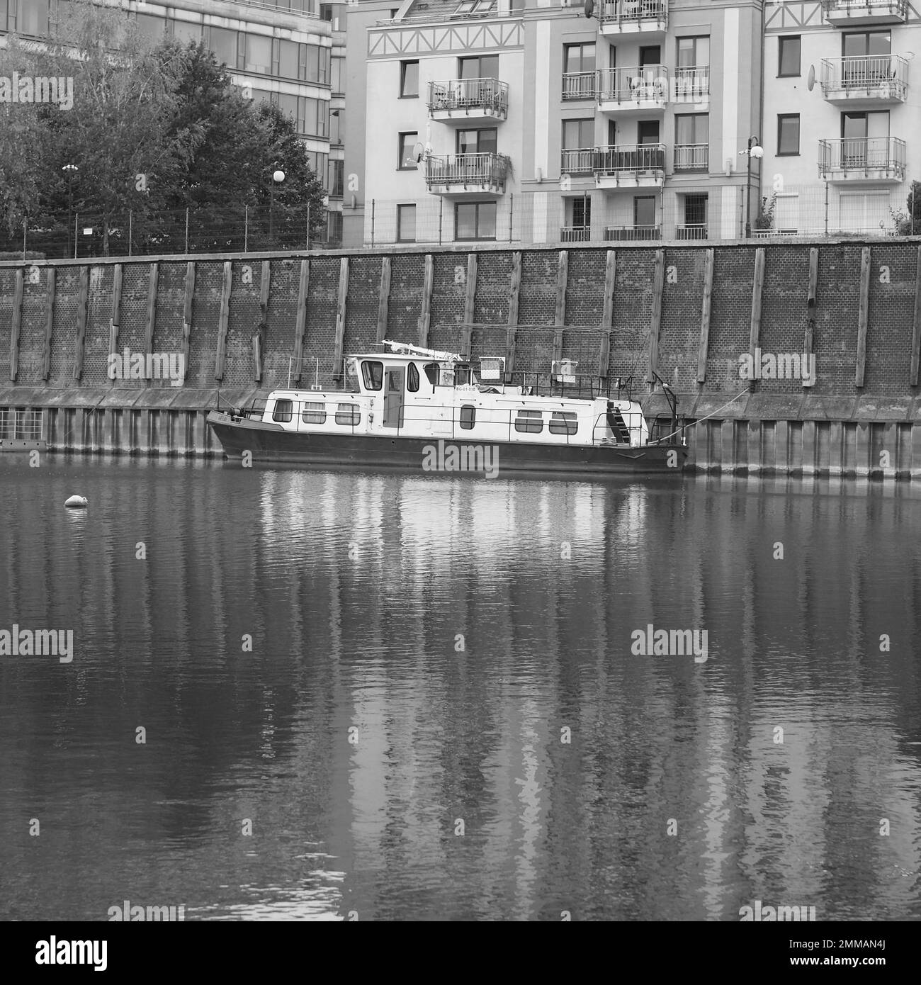 Ship on the Warta river in front of the wall Stock Photo - Alamy