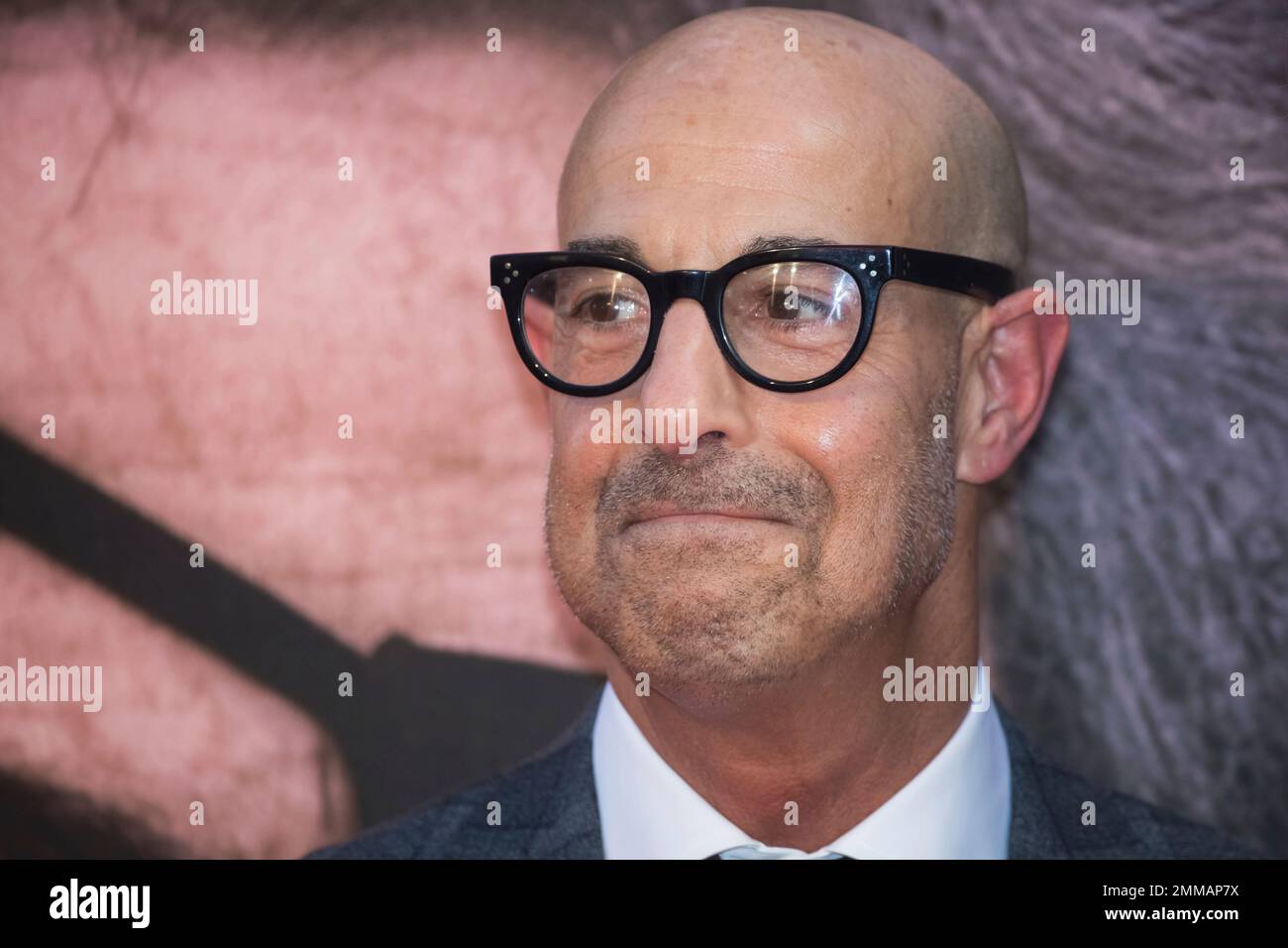 Actor Stanley Tucci poses for photographers upon arrival at the ...