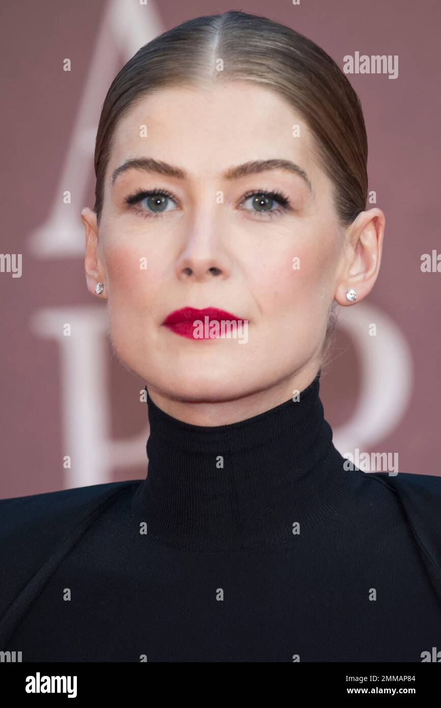 Actress Rosamund Pike poses for photographers upon arrival at the ...
