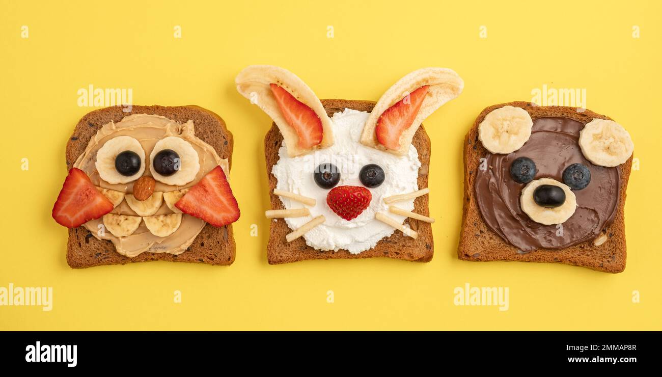 Funny animal faces toasts for kids lunch Stock Photo - Alamy