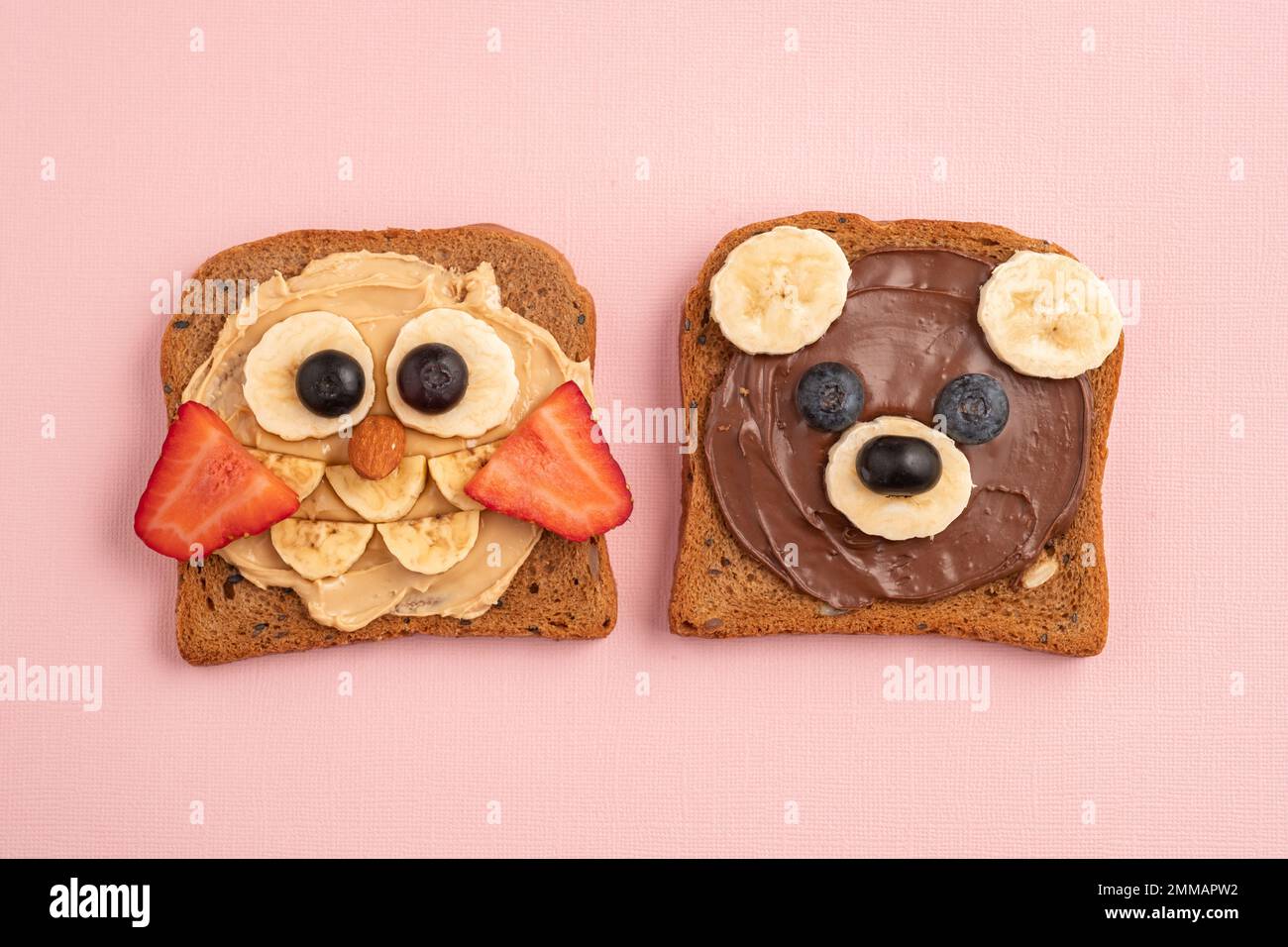 Funny animal faces toasts for kids lunch Stock Photo - Alamy