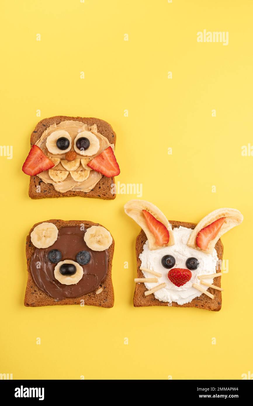 Funny animal faces toasts for kids lunch Stock Photo - Alamy
