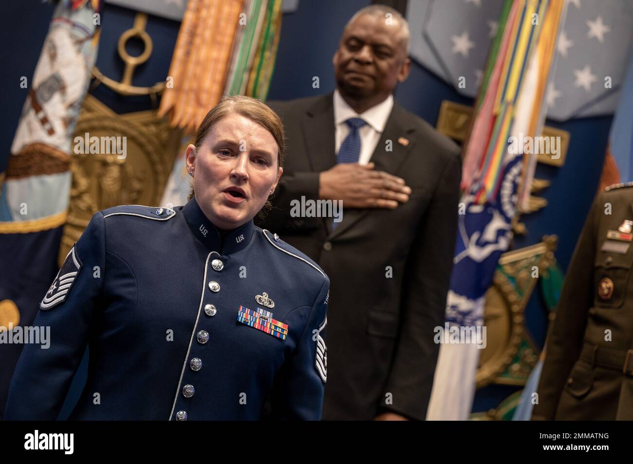 Secretary of Defense Lloyd J. Austin III renders honors as a soloist ...