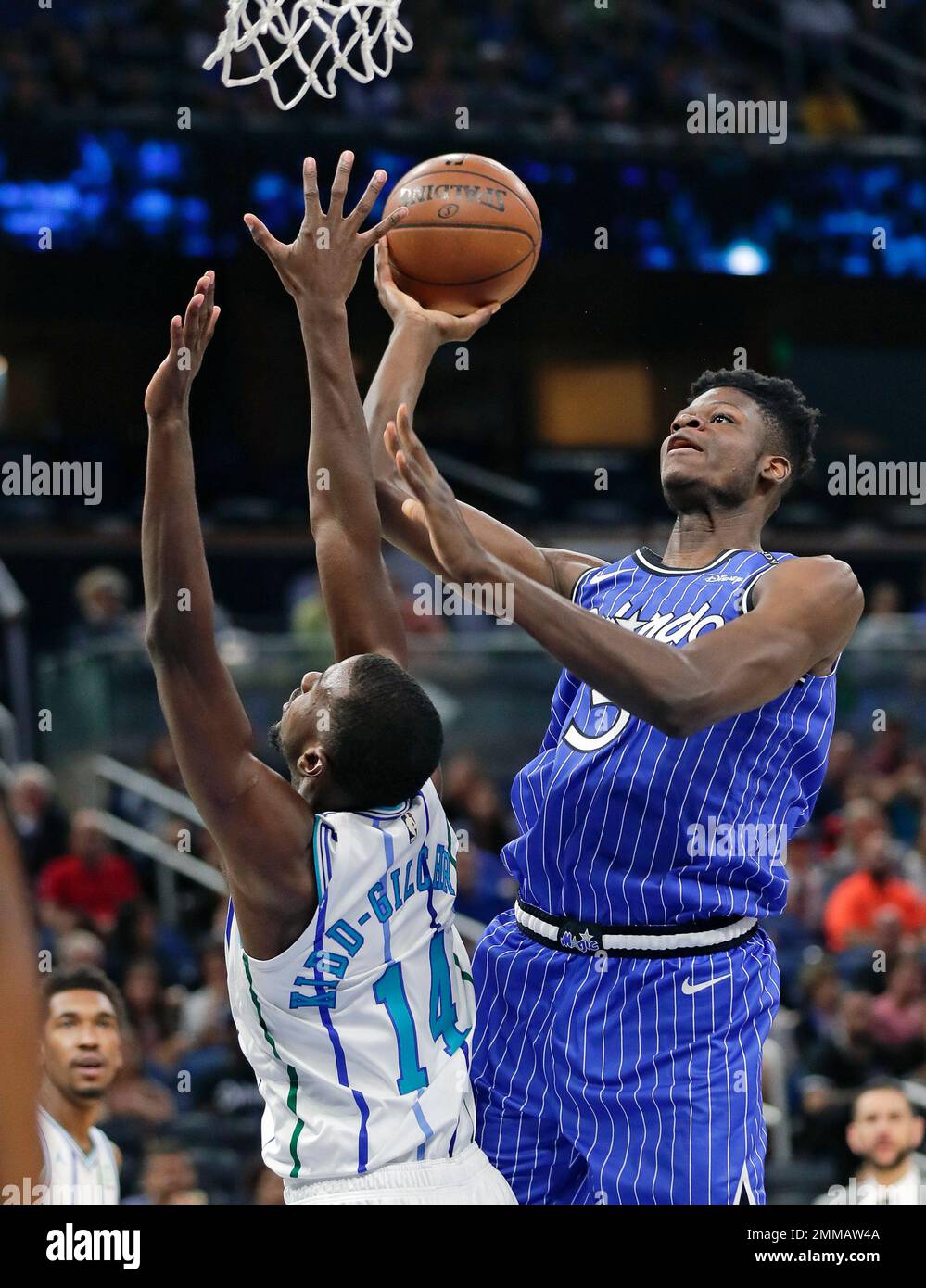 Orlando Magic's Mohamed Bamba, right, shoots over Charlotte Hornets ...