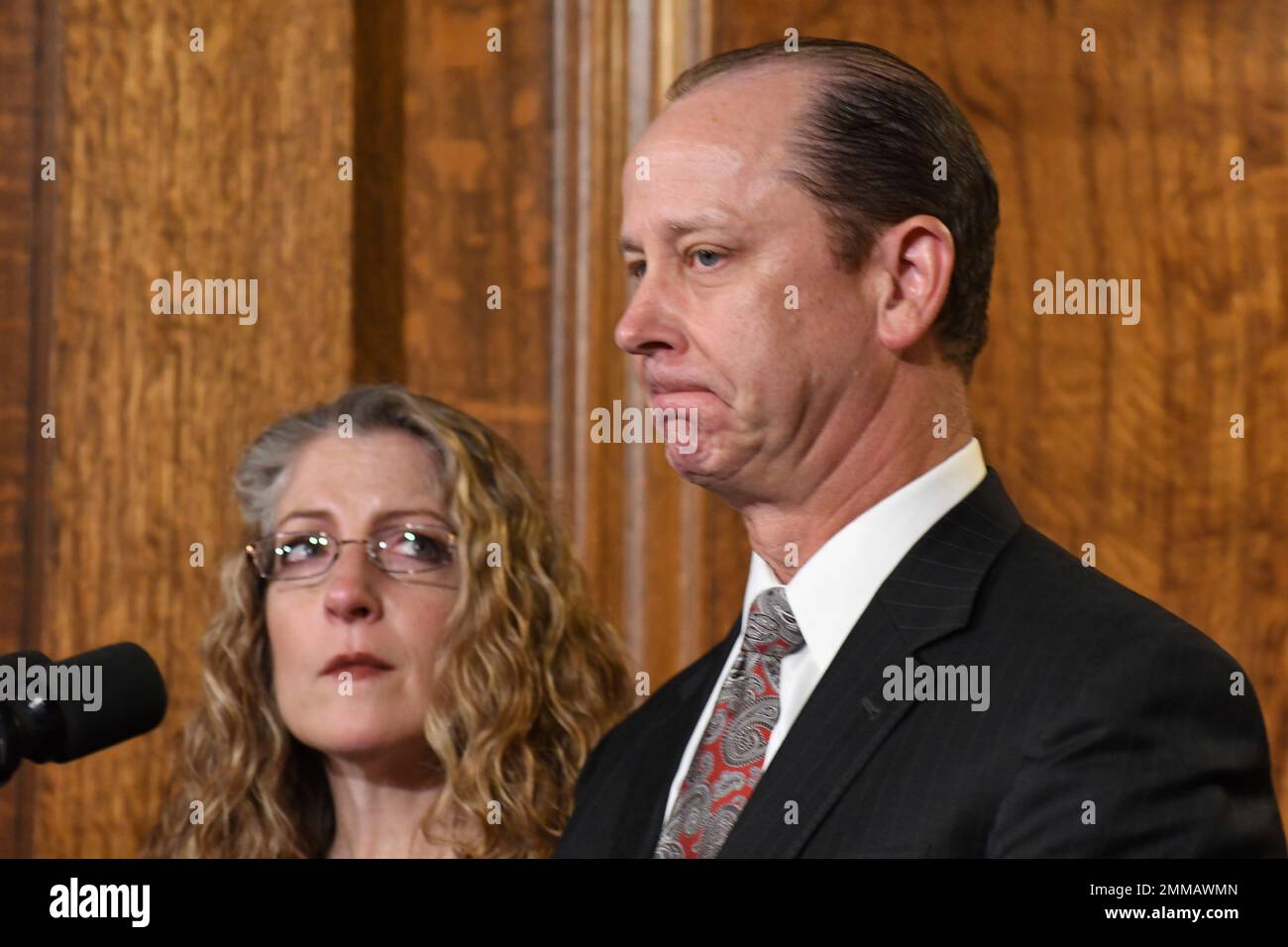 Jim Piazza, standing next to his wife Evelyn, pauses while speaking at ...