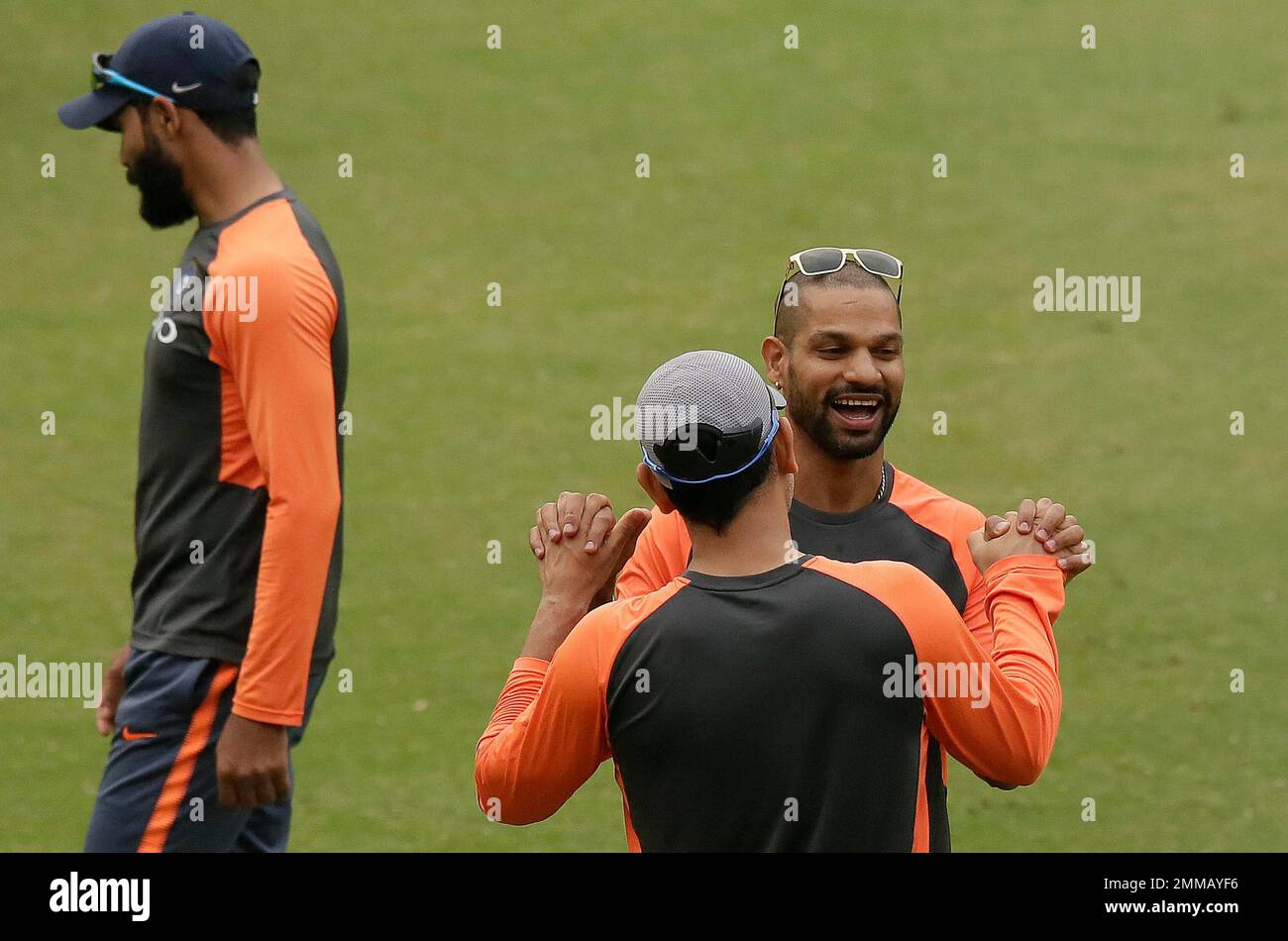Indian cricketer Shikhar Dhawan, foreground and right, and MS Dhoni ...