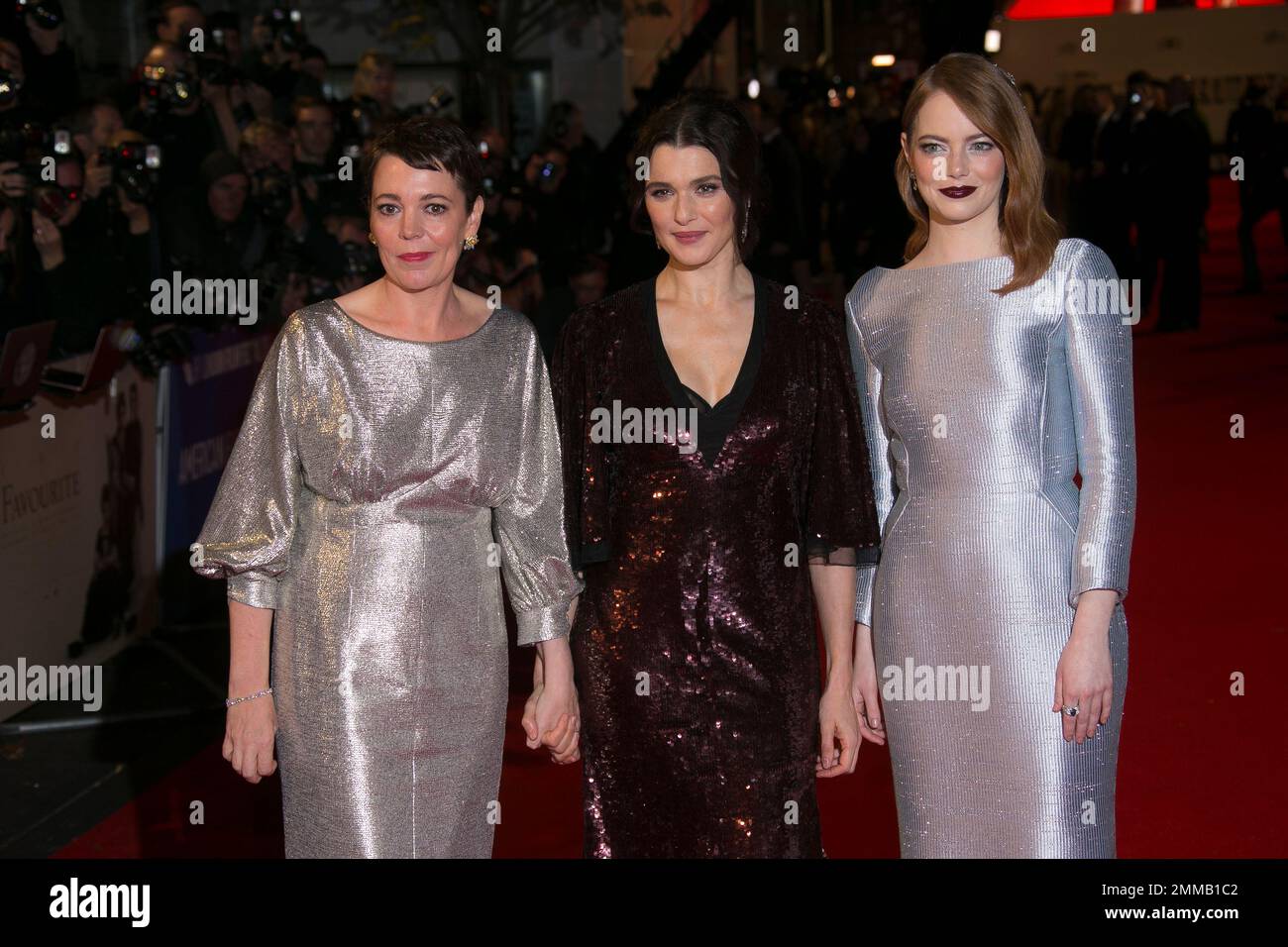 Actresses Olivia Colman, from left, Rachel Weisz and Emma Stone pose ...