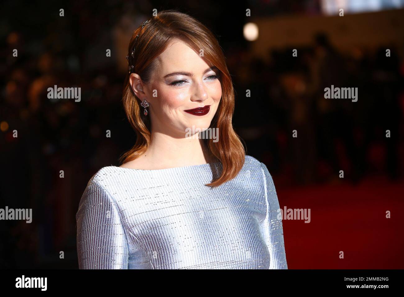 Actress Emma Stone poses for photographers upon arrival at the premiere ...