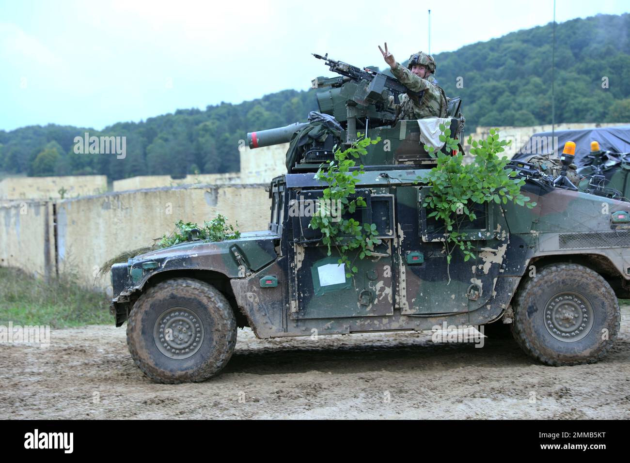 HOHENFELS, Germany – A U.S. Army turret gunner gestures the peace sign ...