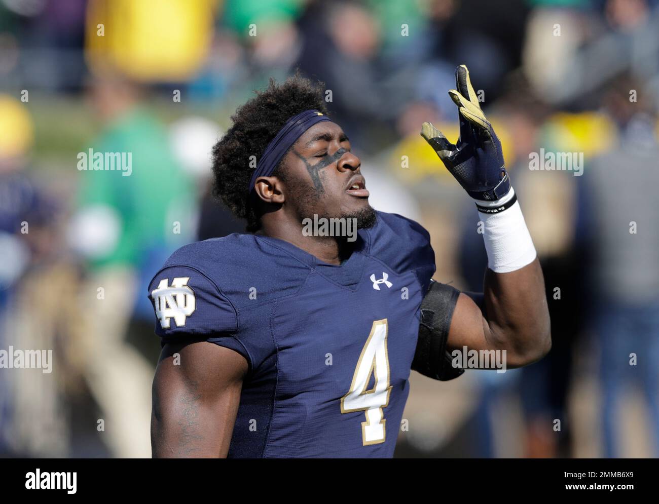 Notre Dame linebacker Te'von Coney (4) prepares for an NCAA college ...