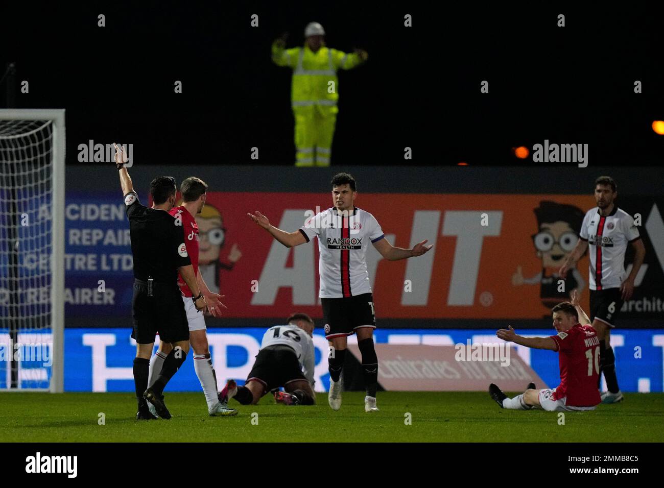 John Egan #12 of Sheffield United reacts to Referee Dean Whitestone ...