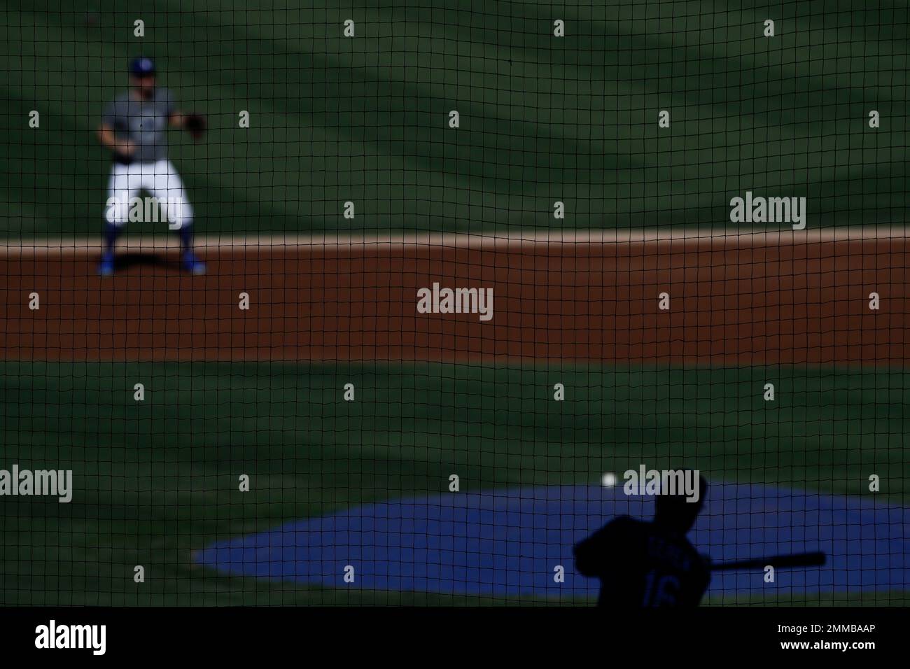 Los Angeles Dodgers bench coach Bob Geren hits a ball before Game 4 of ...