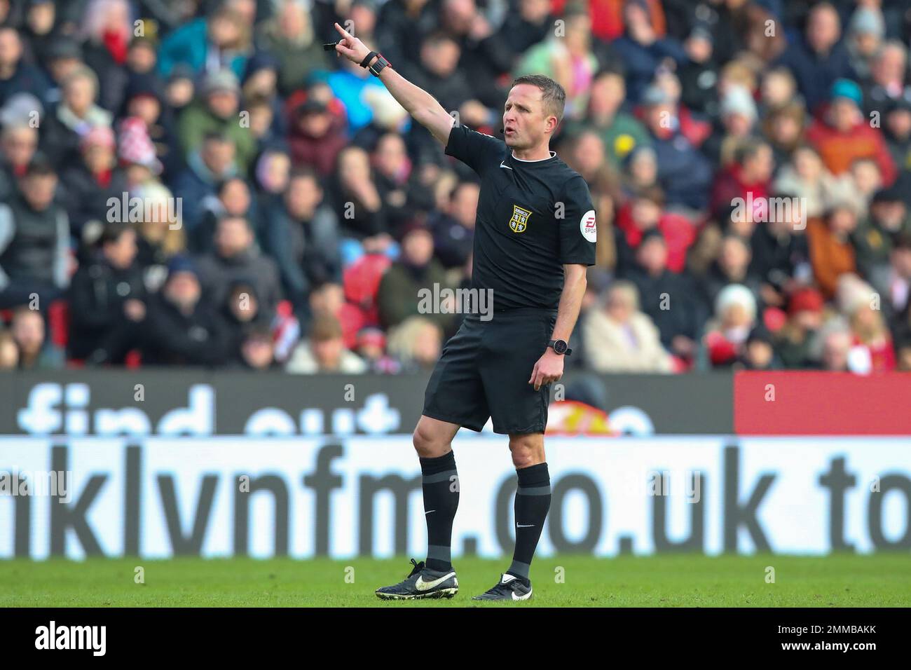 Referee David Webb points for a corner kick during the Emirates FA Cup ...