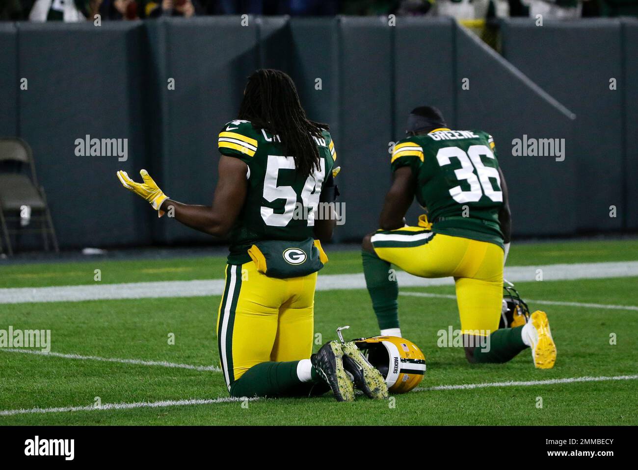 Green Bay Packers linebacker James Crawford (54) and Raven Greene (36 ...