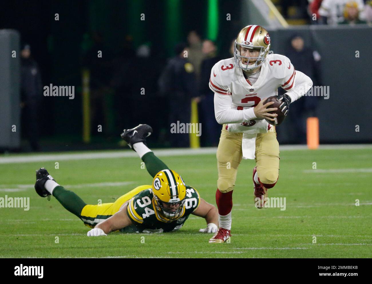 San Francisco 49ers quarterback C.J. Beathard (3) escapes Green Bay ...