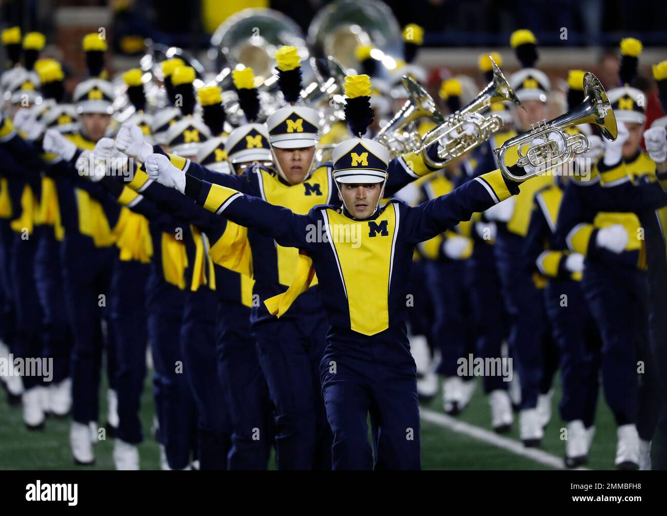Michigan's marching band take the field to perform before an NCAA ...