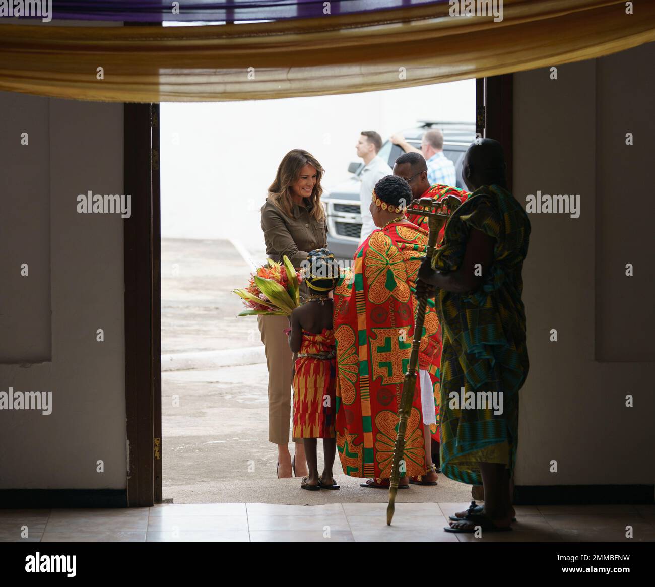 First lady Melania Trump is given flowers as she arrives at the ...