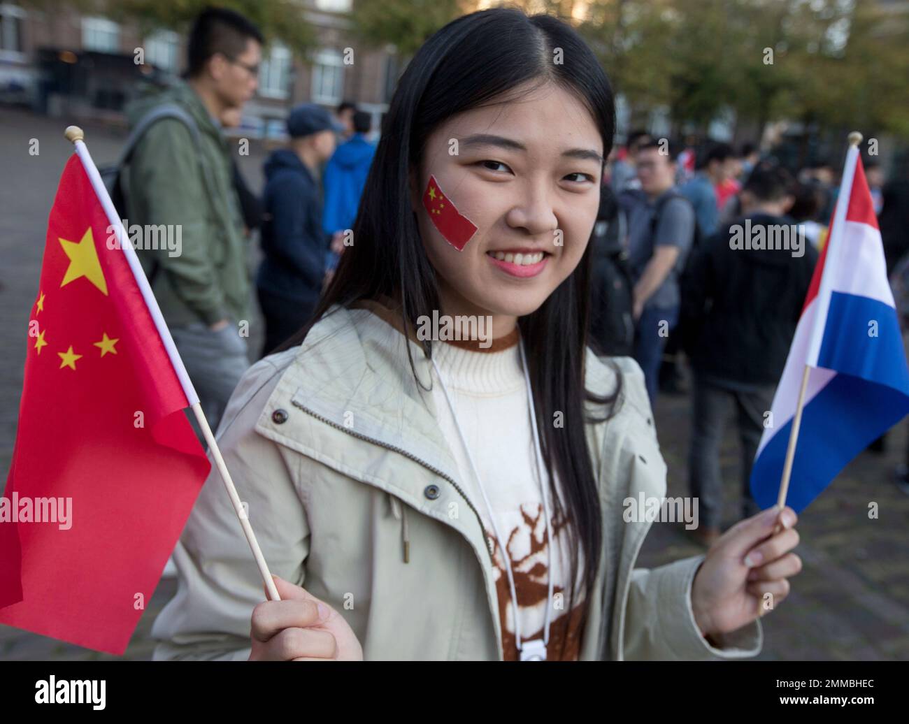 Members of the Chinese community in The Netherlands wait for the ...