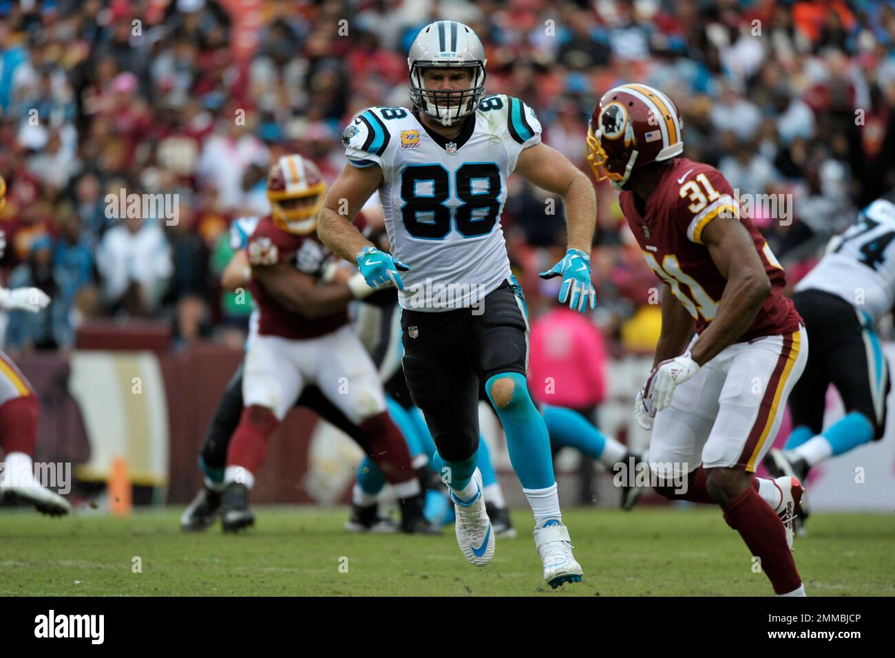 Carolina Panthers tight end Greg Olsen (center) runs a pass route ...