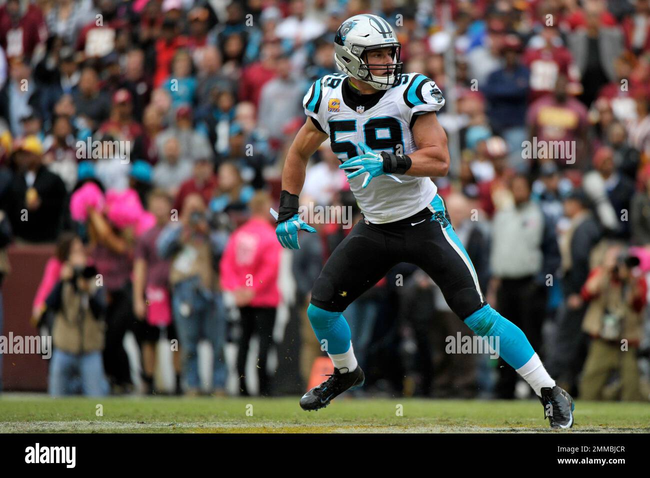 Carolina Panthers linebacker Luke Kuechly drops into coverage during an ...