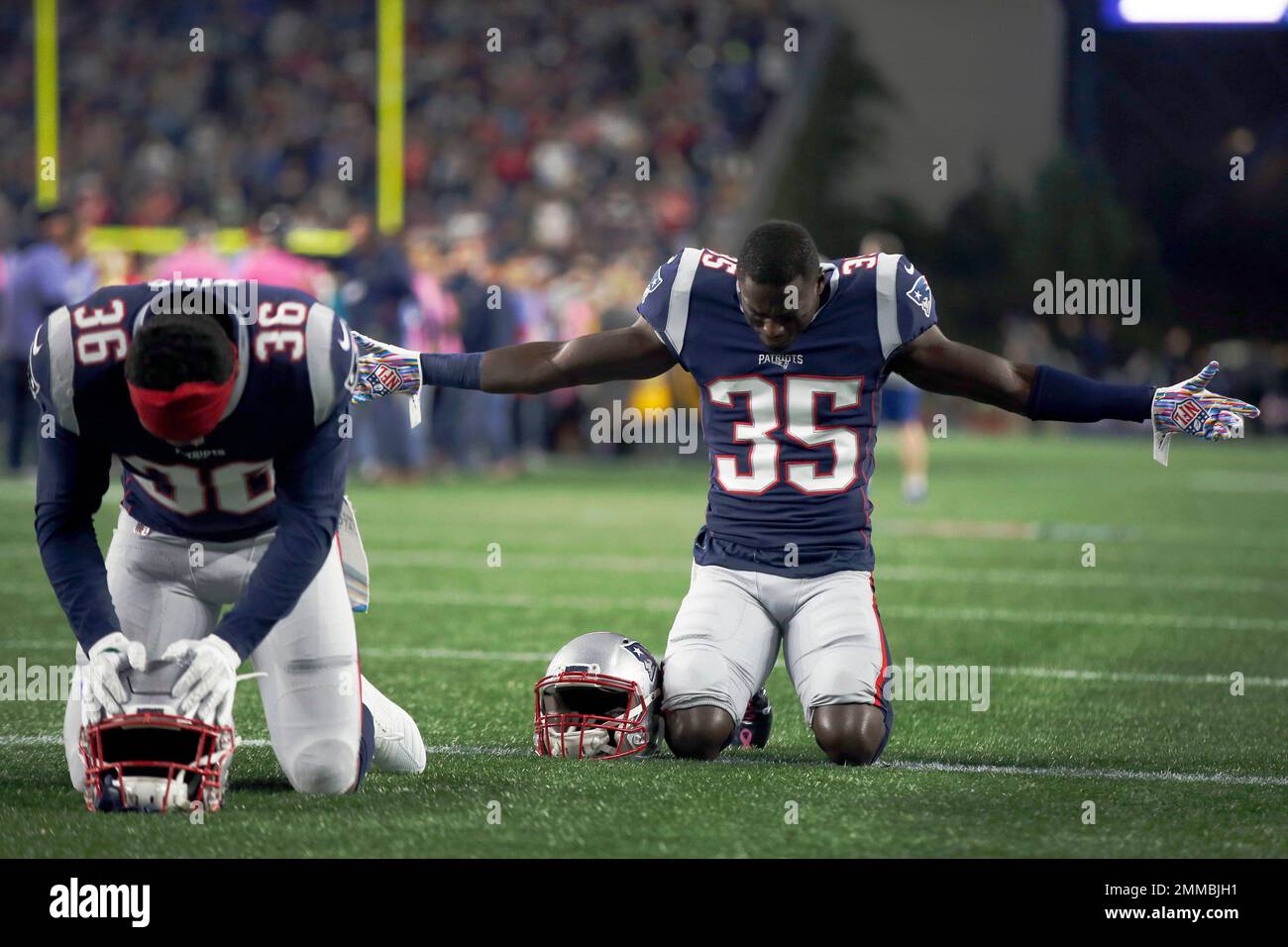 New England Patriots defensive backs Brandon King (36) and Keion ...