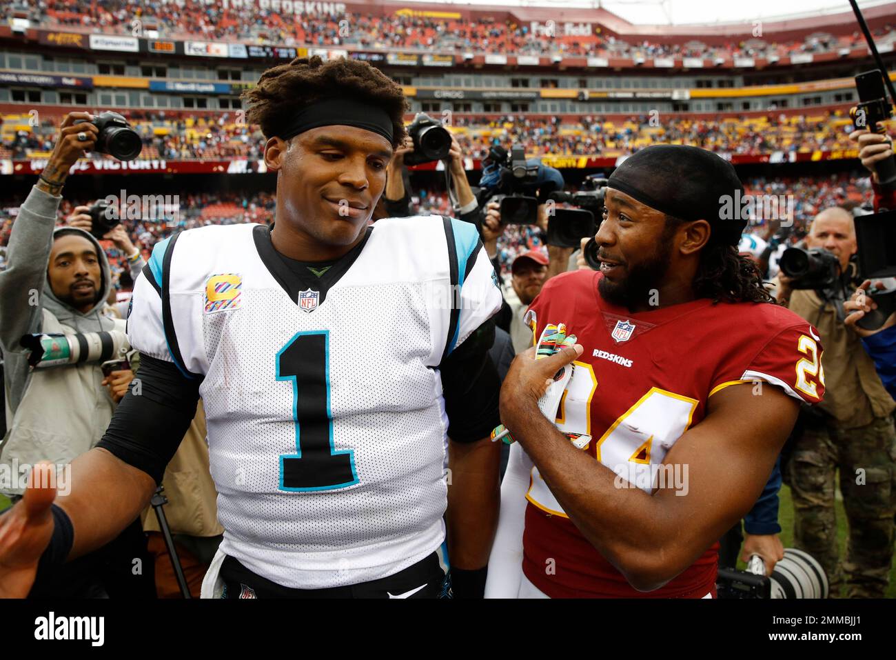 Washington Redskins cornerback Josh Norman, right, speaks with Carolina ...