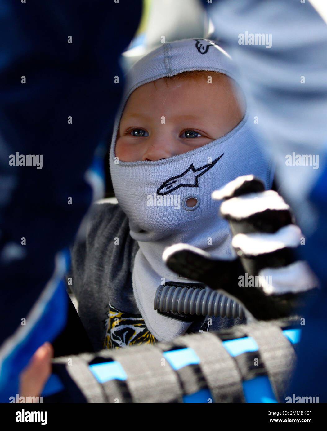 Kyle Larson's son, Owen, sits in the car dressed in his father's racing ...
