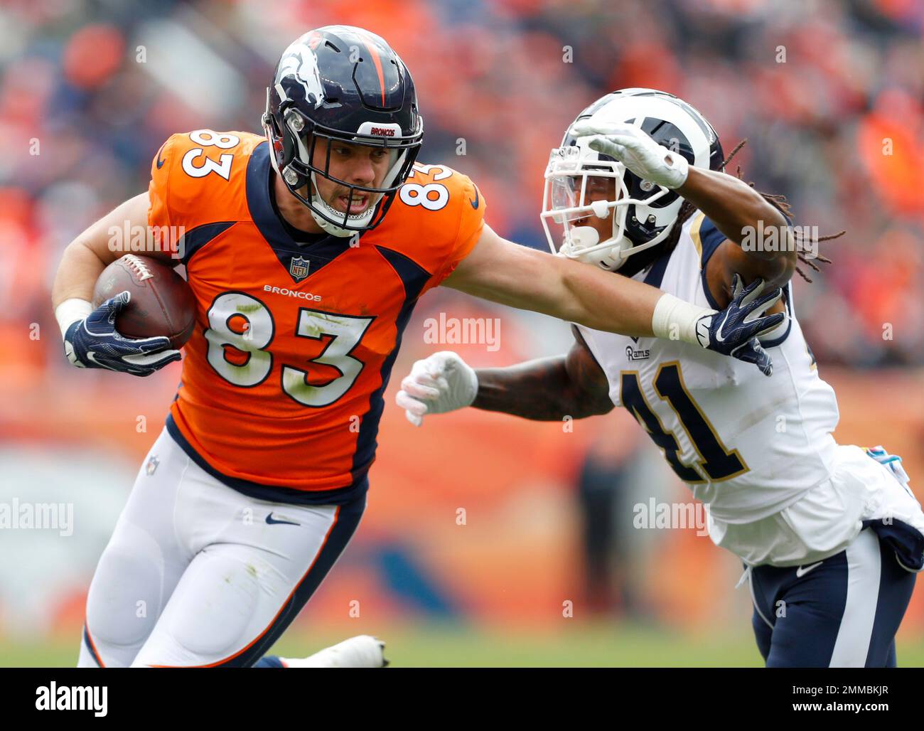 Denver Broncos tight end Matt LaCosse (83) tries to elude Los Angeles ...