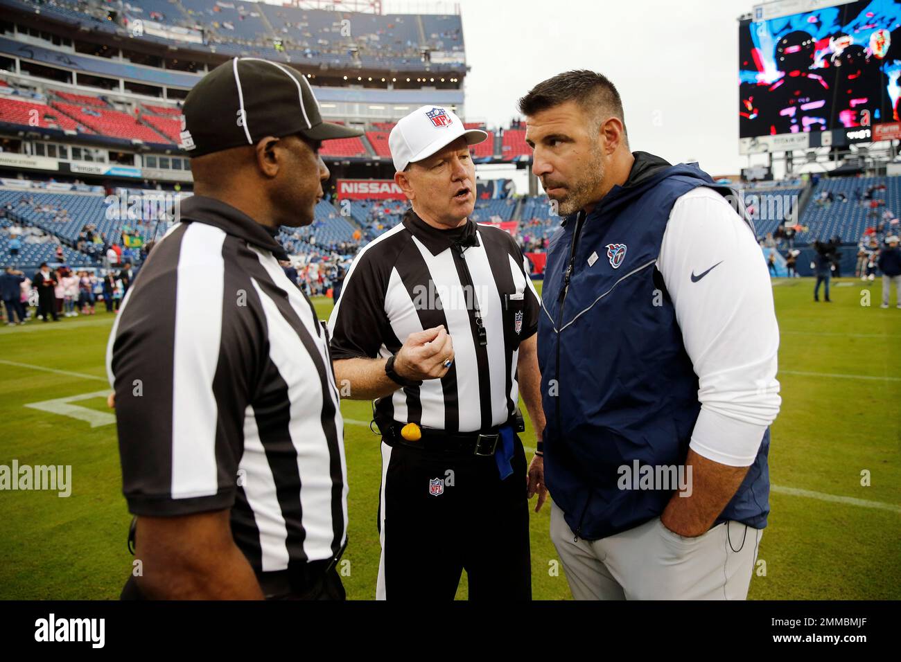 Tennessee Titans head coach Mike Vrabel, right, talks with referee Carl ...